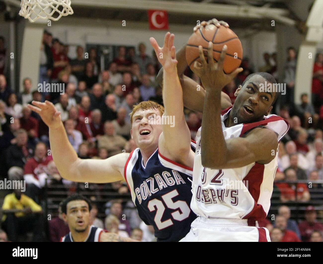 St. Joseph's Idris Hilliard grabs a rebound from Gonzaga's David ...