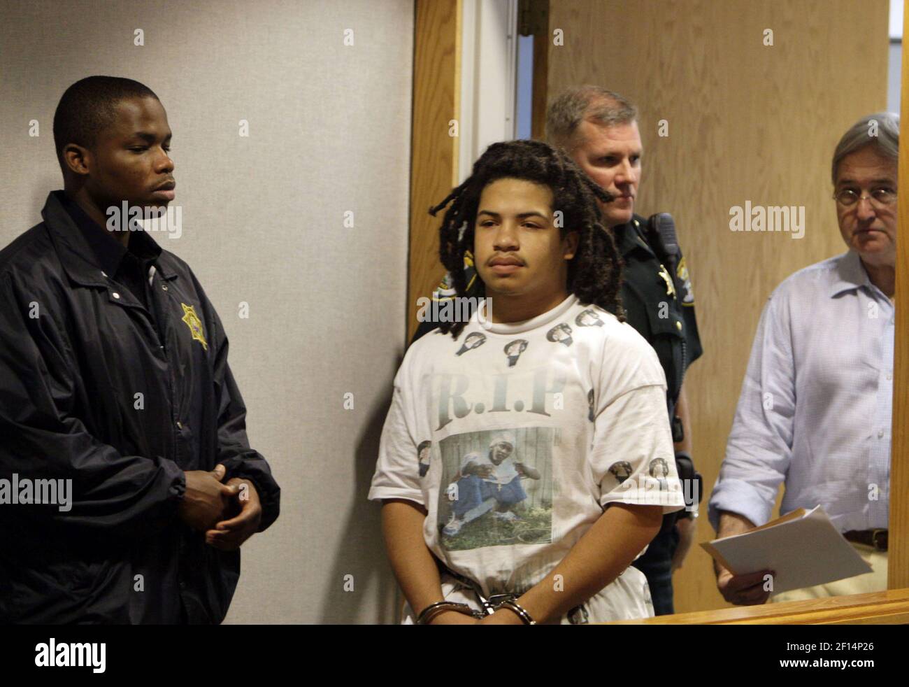 Eric Rivera 17, followed by his attorney Wilbur Smith, makes his first ...