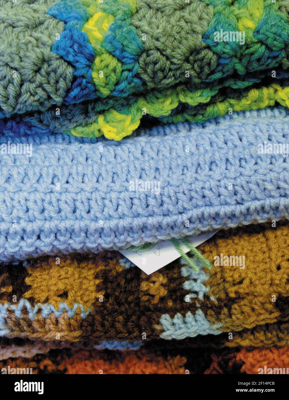 A stack of lap robes and shawls crocheted by Lena Reda and Marion ...
