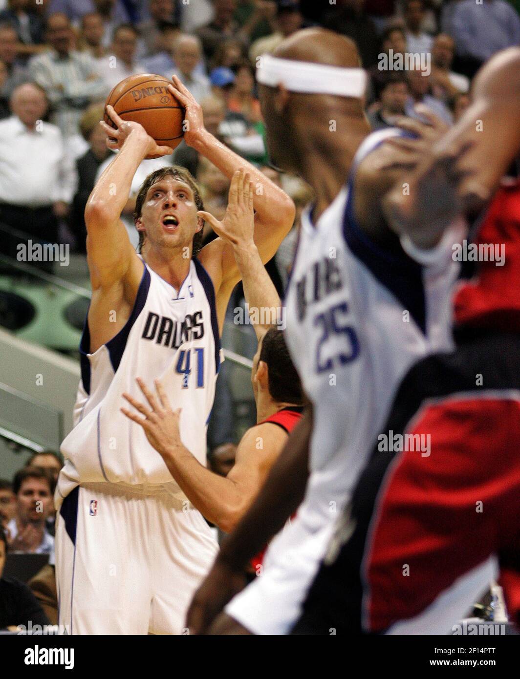 Dallas Mavericks' Dirk Nowitzki (left) hits a three-point shot in the ...