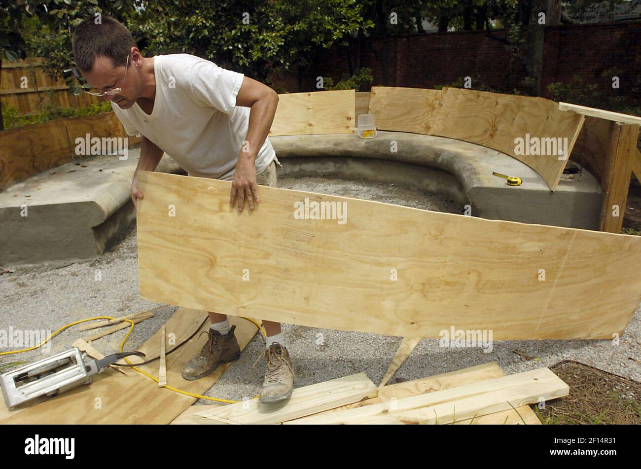 Contractor, Andy Adams, makes a concrete bench for the historic Seibel ...