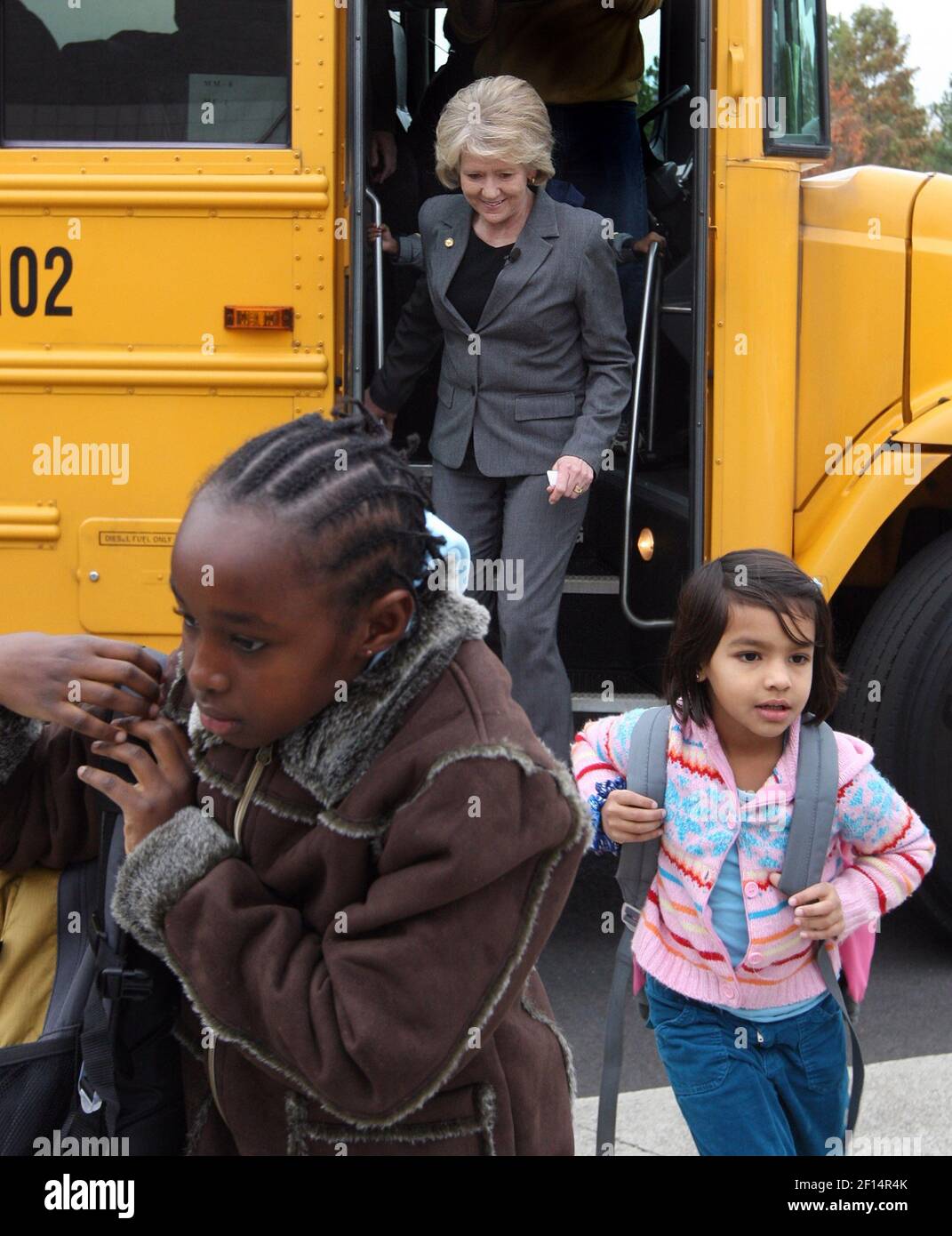 U.S. Transportation Secretary Mary E. Peters gets off the school bus ...