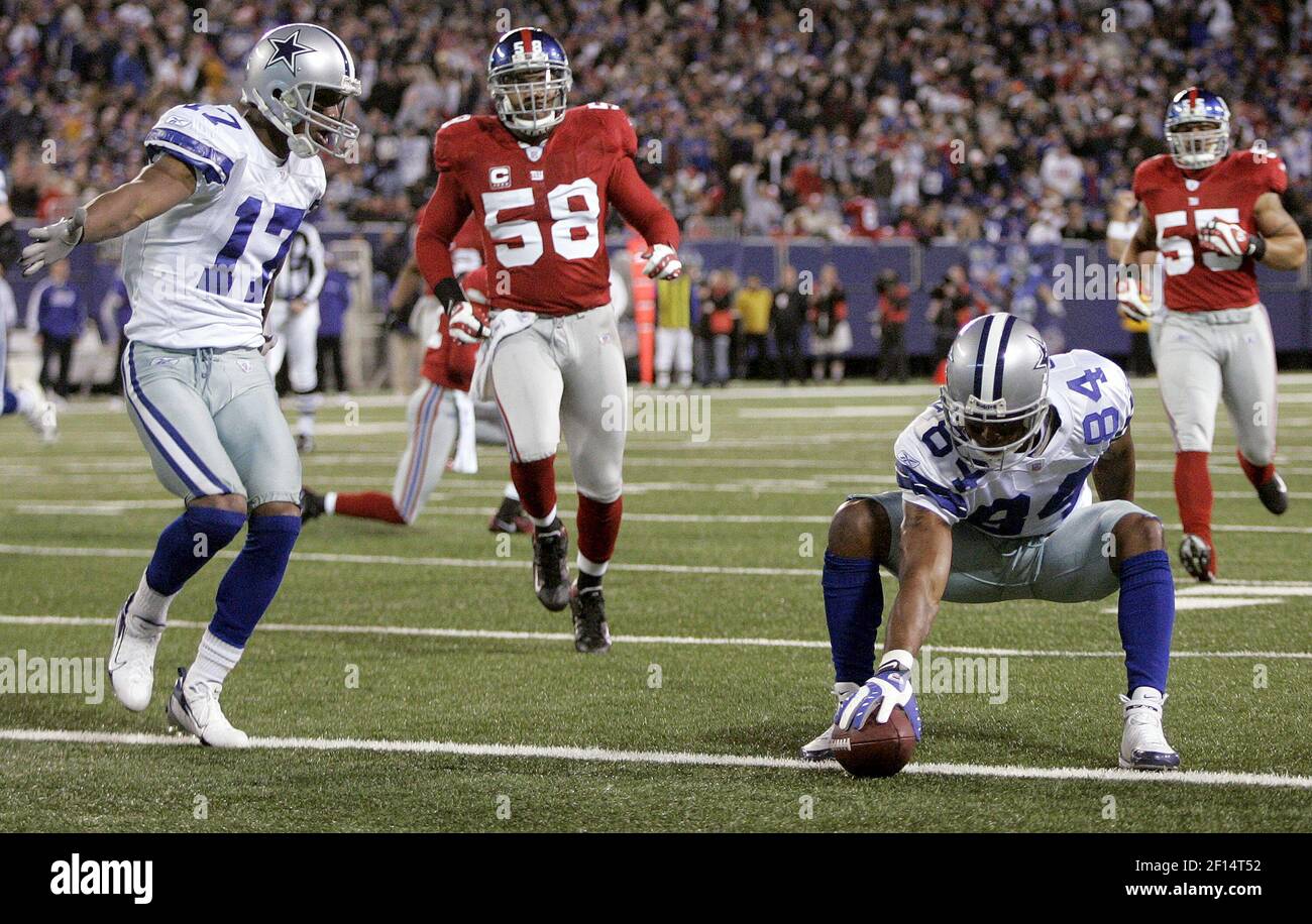 Dallas Cowboys wide receiver Patrick Crayton (84) places the ball on ...