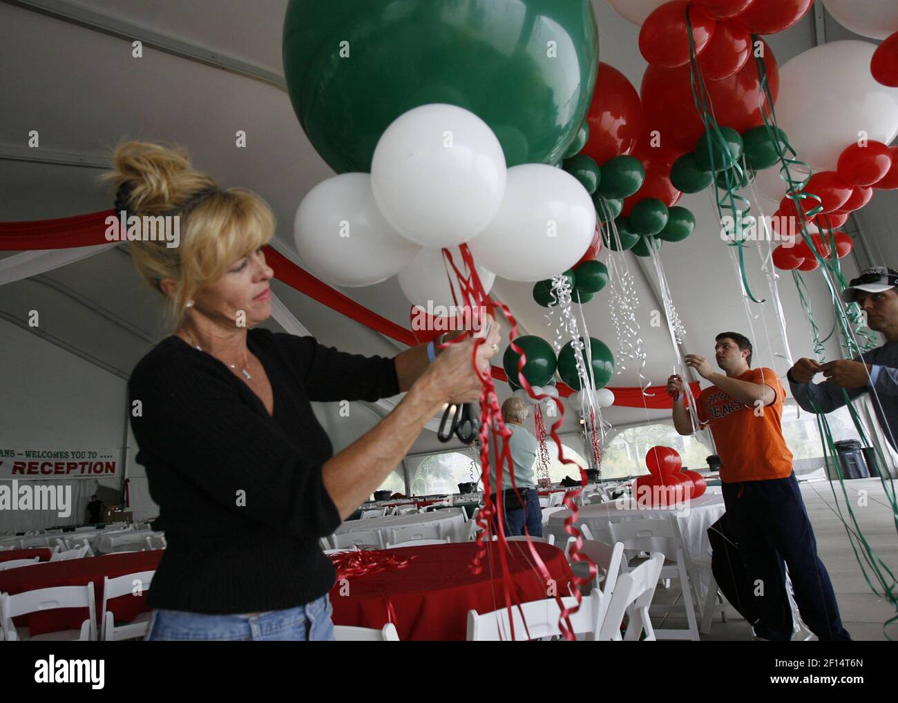Cindi Cronin, owner of Balloons Instead, prepares balloon decorations ...
