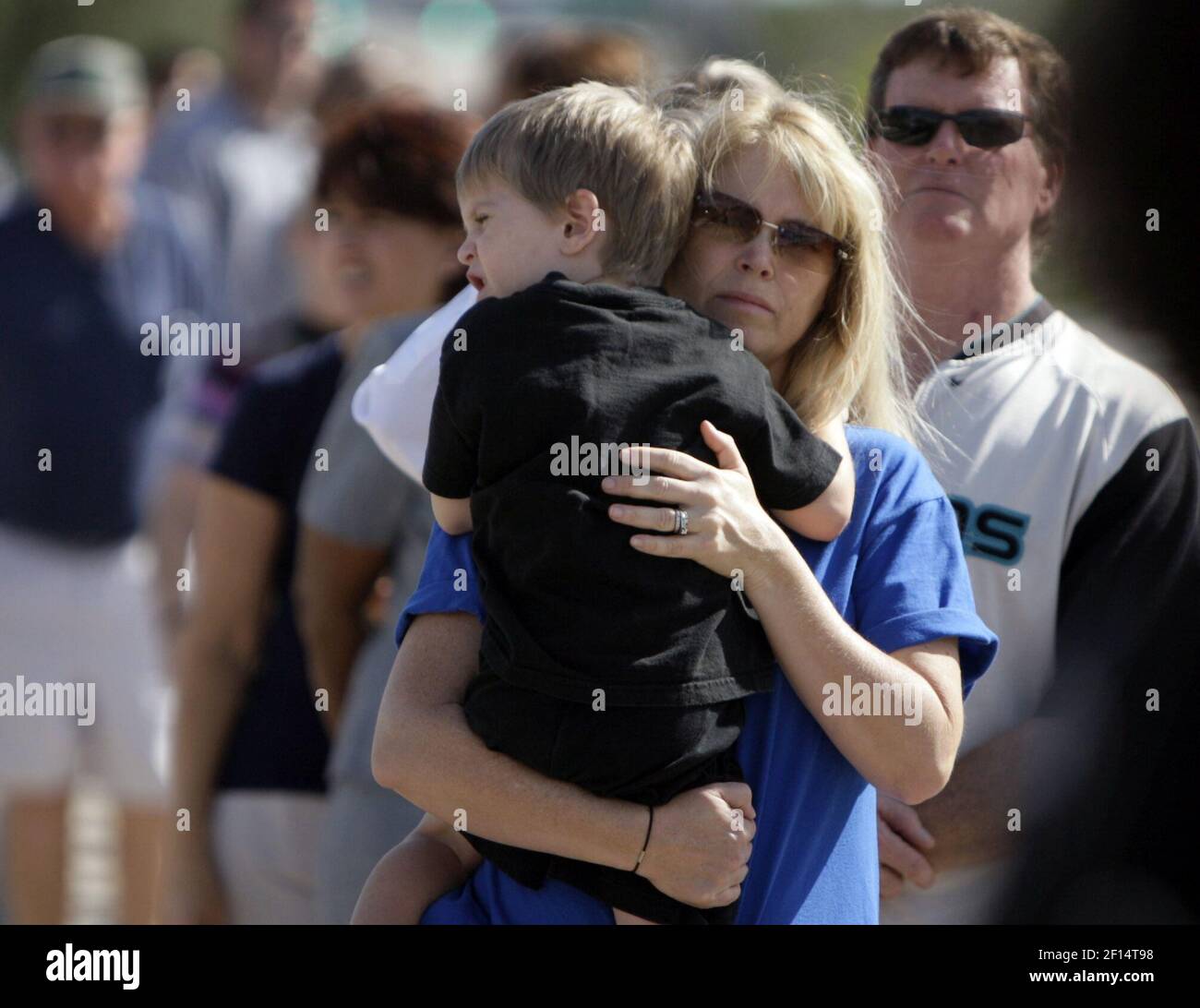 BSO Deputy Eric Anderson (right) with his wife Ginny Anderson, and ...