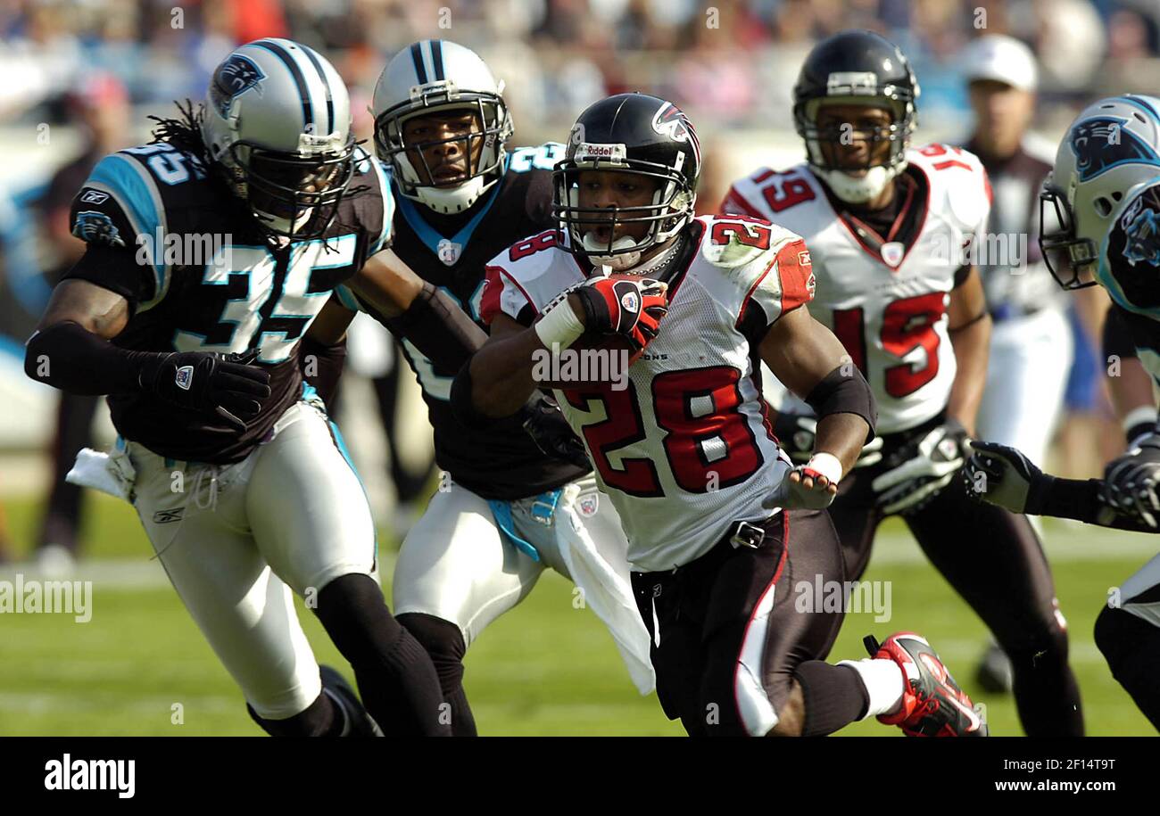 Atlanta Falcons running back Warrick Dunn (28) races past the Carolina ...
