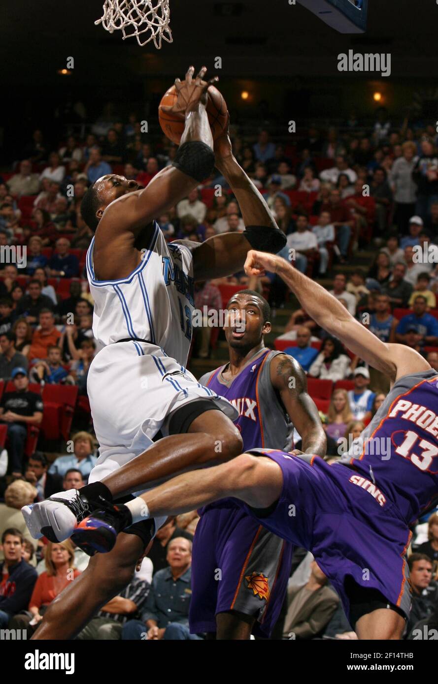 Orlando Magic center Dwight Howard knocks down Phoenix Suns guard Steve ...