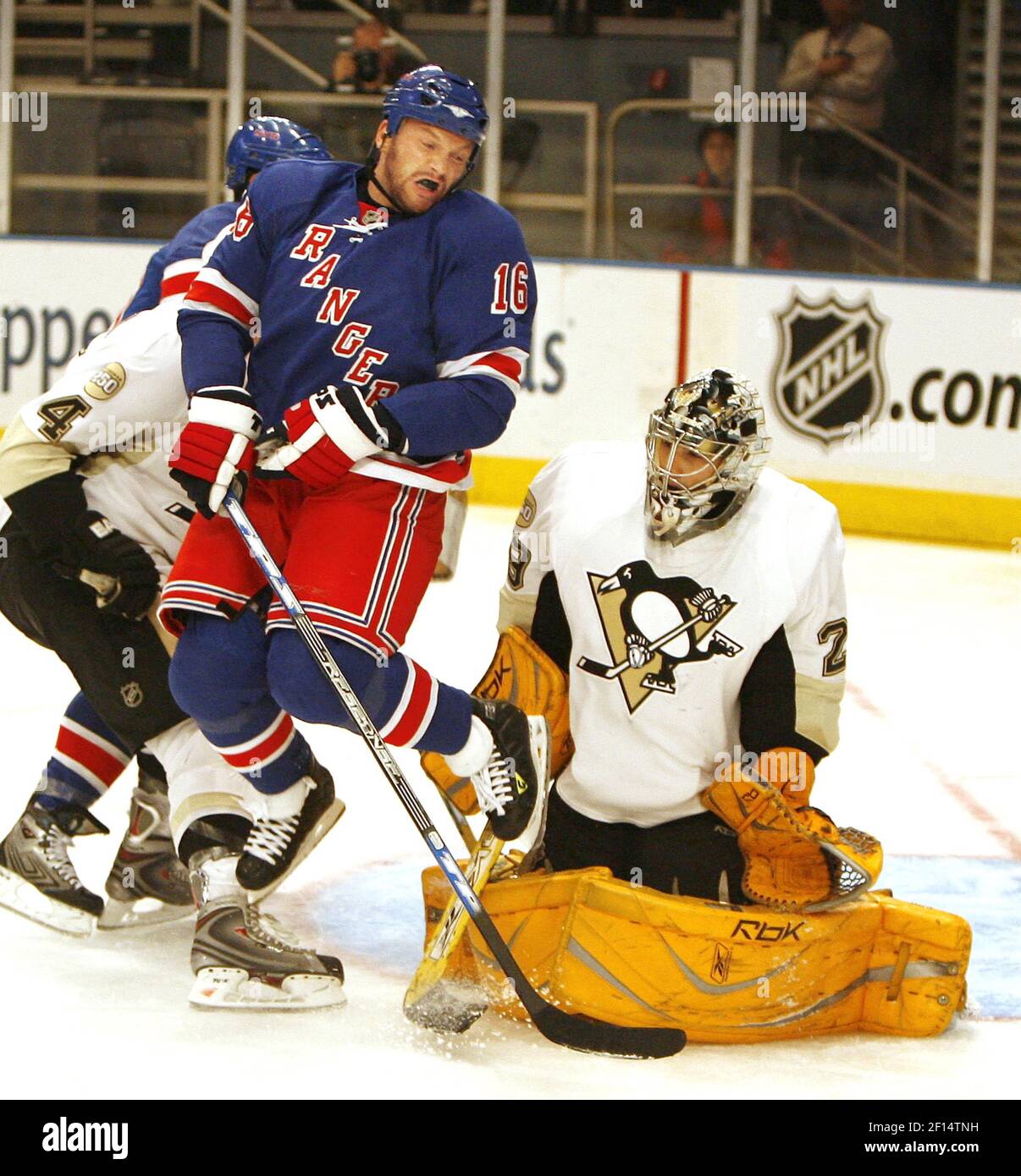 New York Rangers' Sean Avery leaps out of the way of a shot from the ...