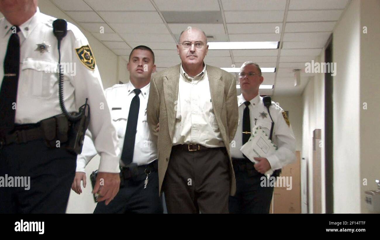 University of Pennsylvania professor Rafael Robb is led into a pretrial ...
