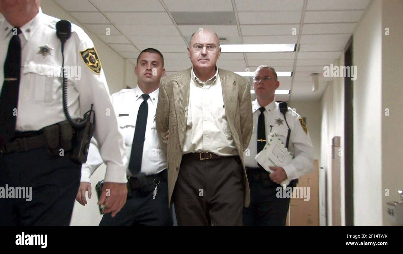 University of Pennsylvania professor Rafael Robb is led into a pretrial ...