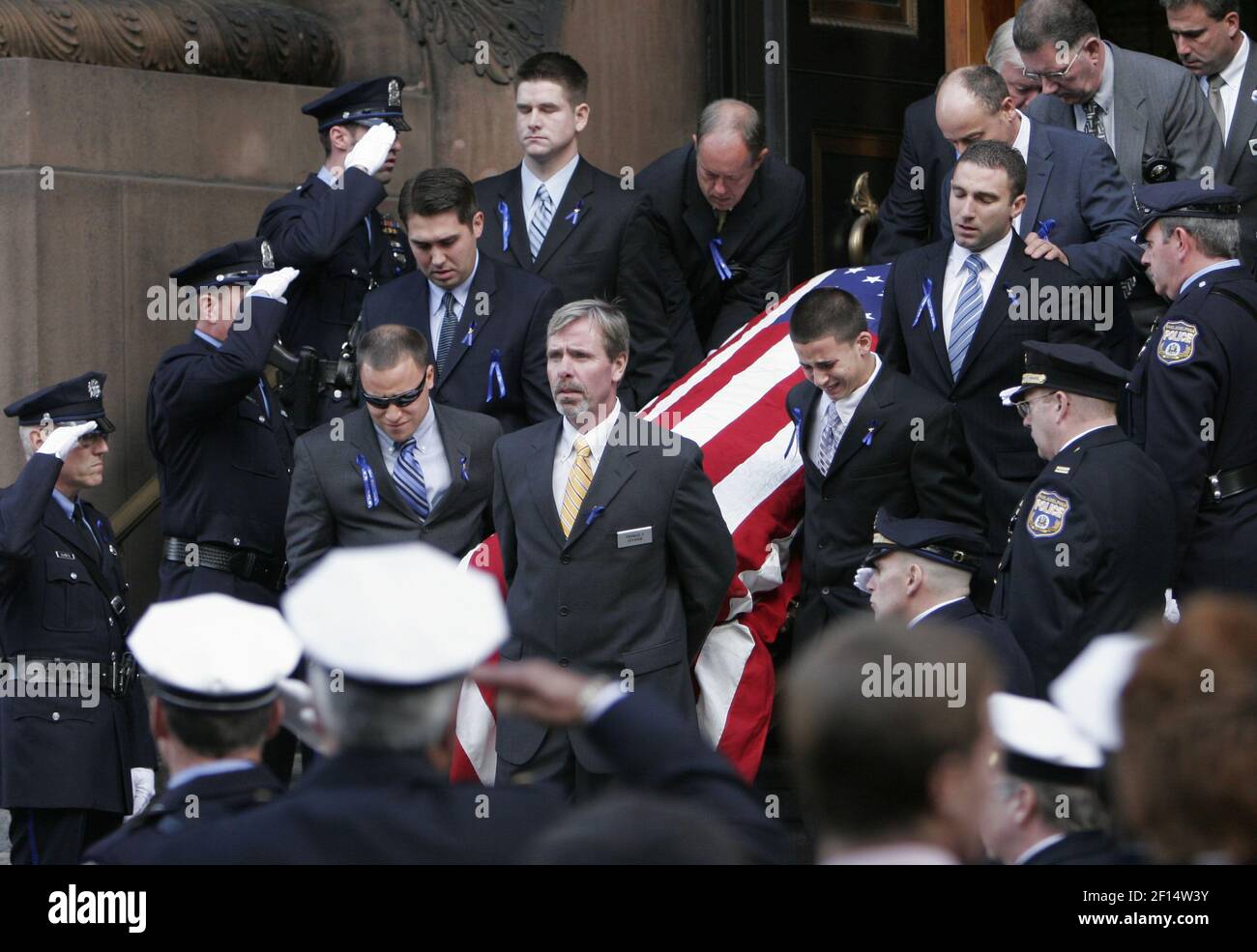 Family members and friends of slain police officer Chuck Cassidy carry ...