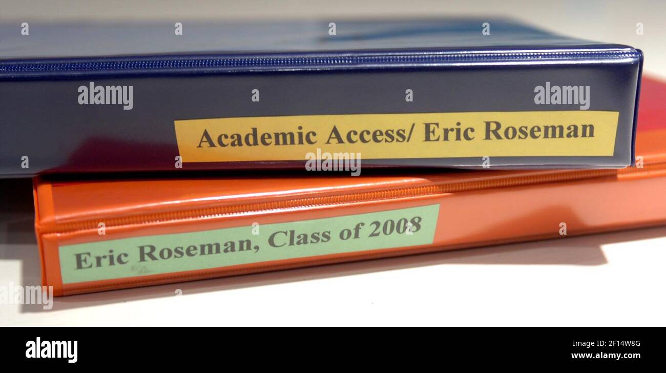 Eric Roseman displays his binders containing all the information and ...
