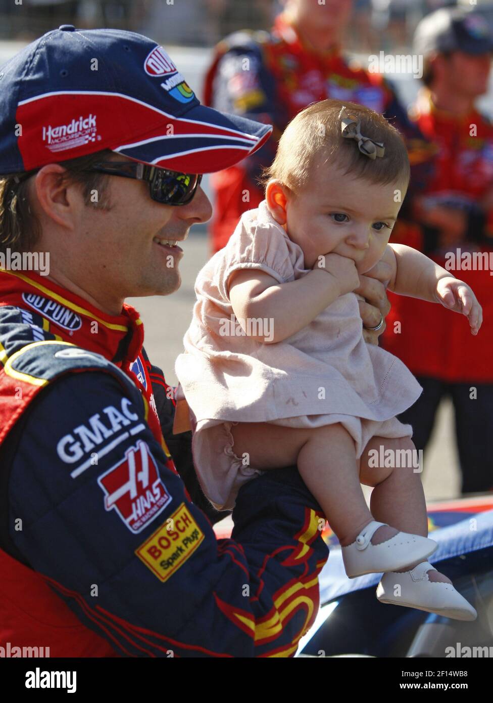 Jeff Gordon holds his daughter, Ella Sofia, before the NASCAR Nextel ...