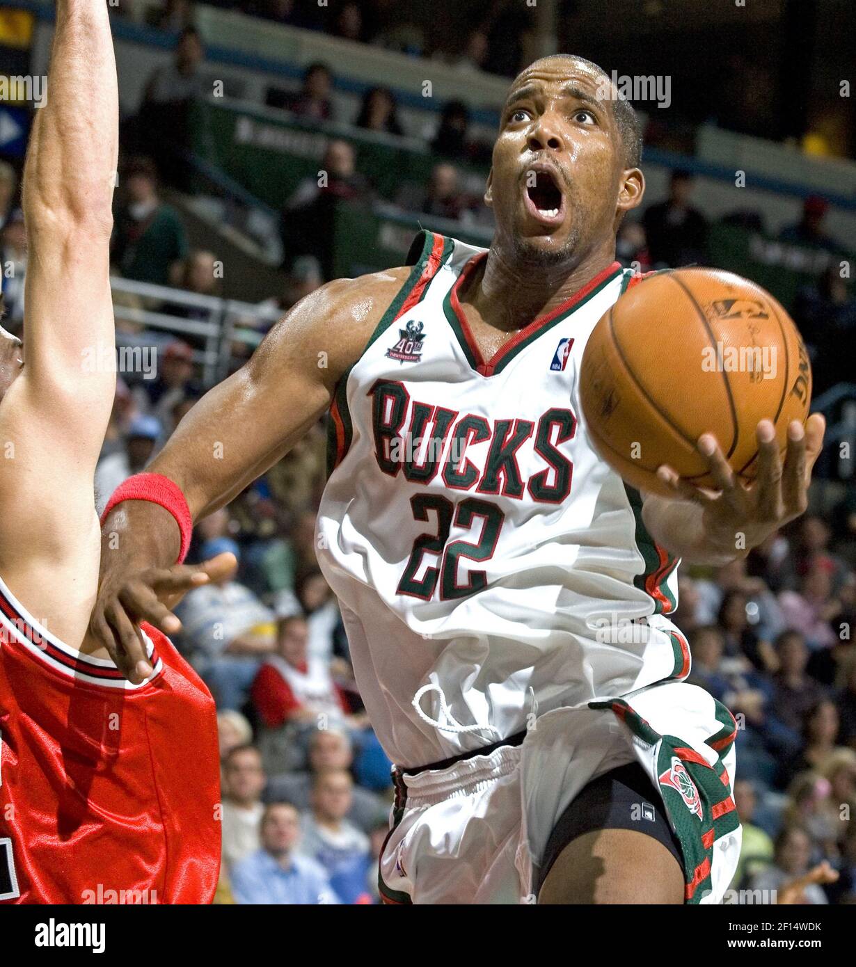 Milwaukee Bucks' Michael Redd drives the lane for a shot in the second ...