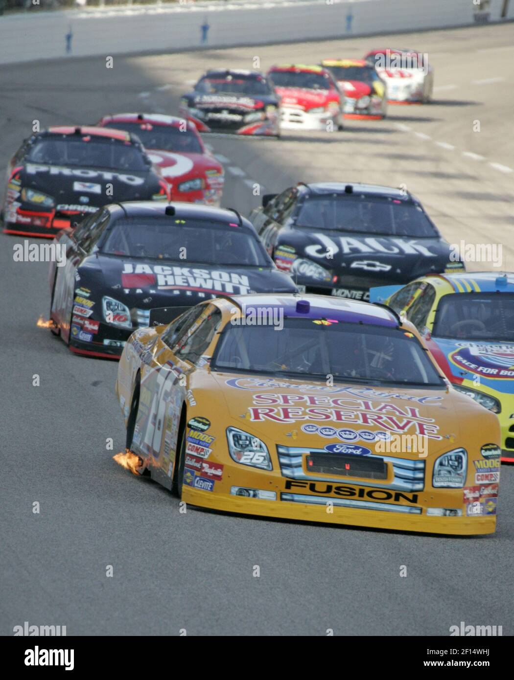 Jamie McMurray leads a pack of cars into turn one early in the NASCAR ...