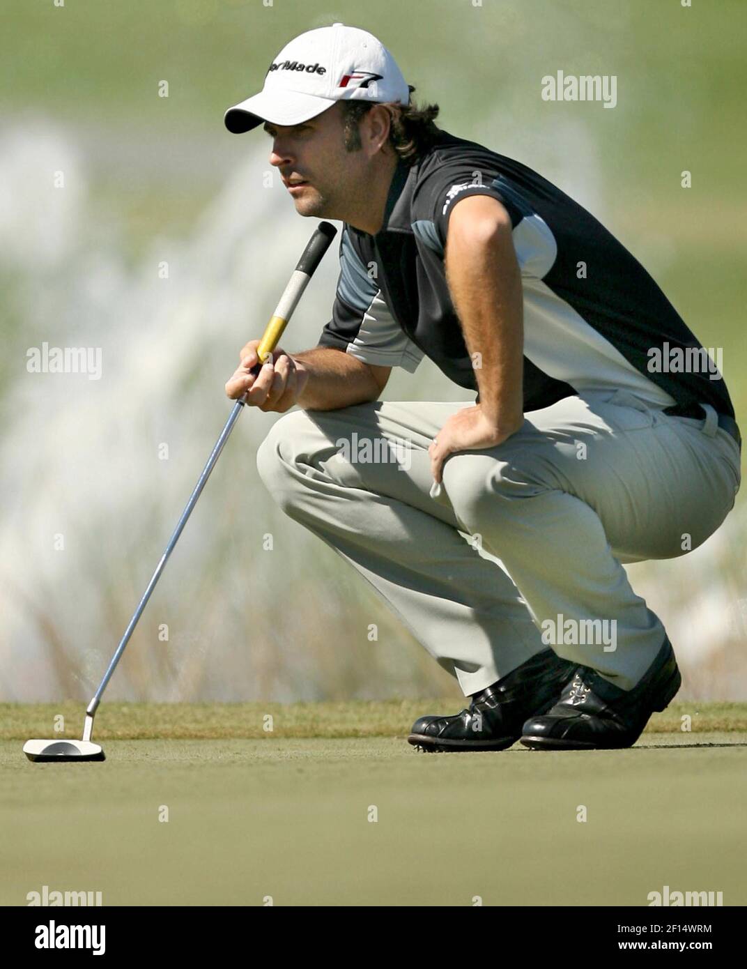 Matthew Goggin lines up a putt on the ninth green during day three of ...