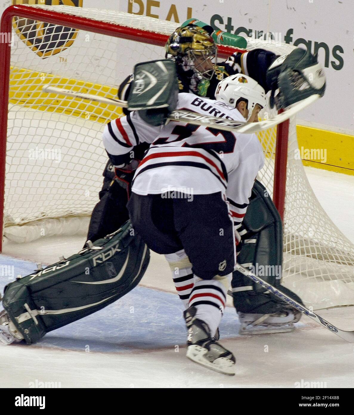 Dallas Stars goalie Marty Turco defends the net as Chicago Blackhawks ...