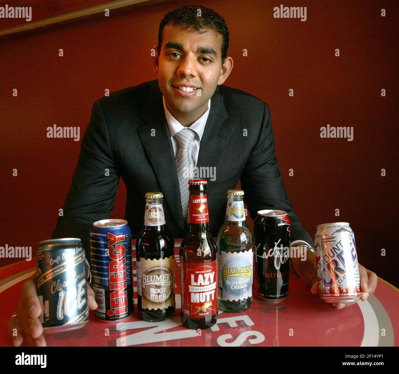 Minhas Craft Brewery owner Ravinder Minhas stands with a selection of ...