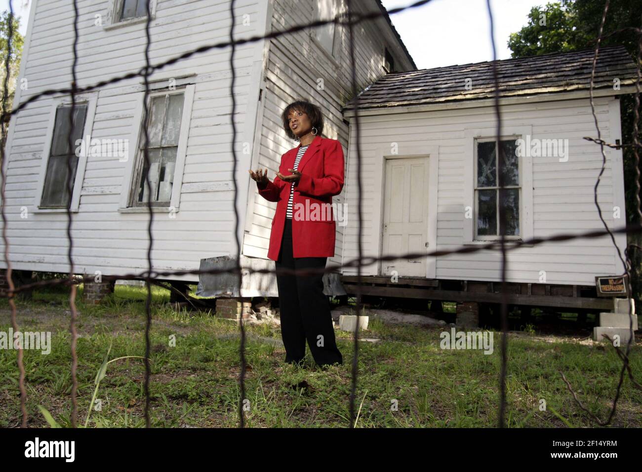 Vicki Oldham stands next to a Civil War era house in Bradenton, Florida ...