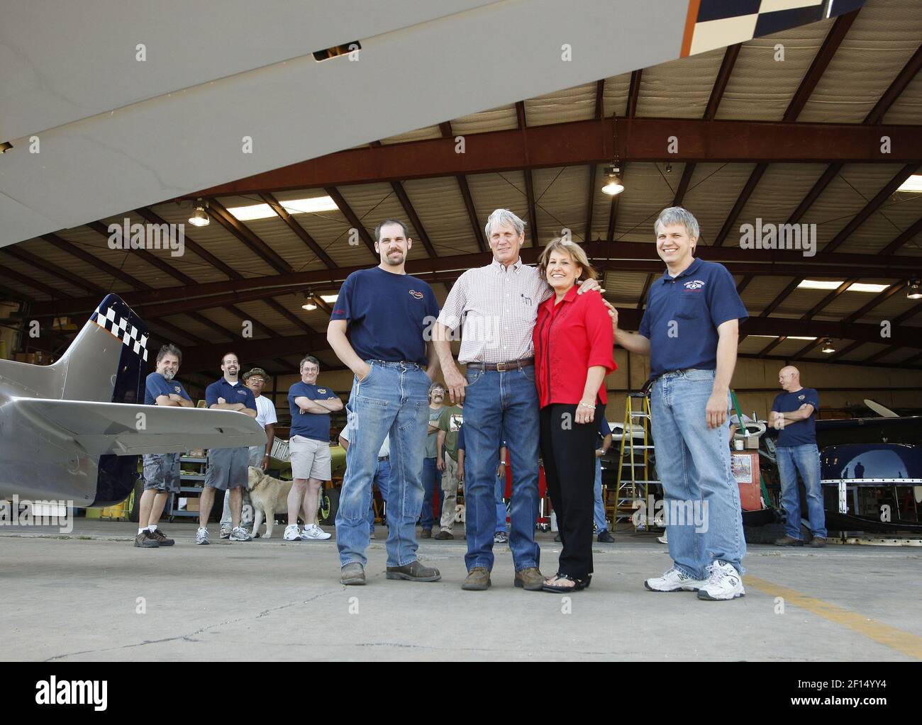 Chad Ezell, from left, his dad and founder Nelson Ezell, Nelson's wife ...