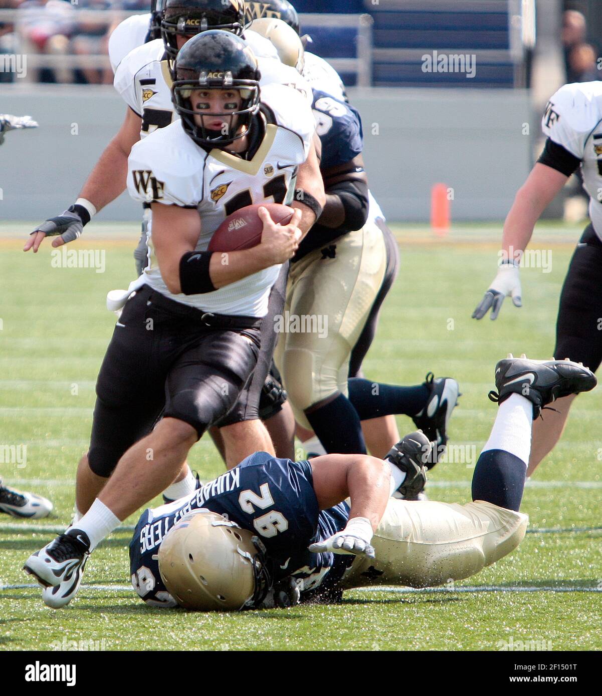 Wake Forest Quarterback Riley Skinner (11) runs for yardage as he steps ...
