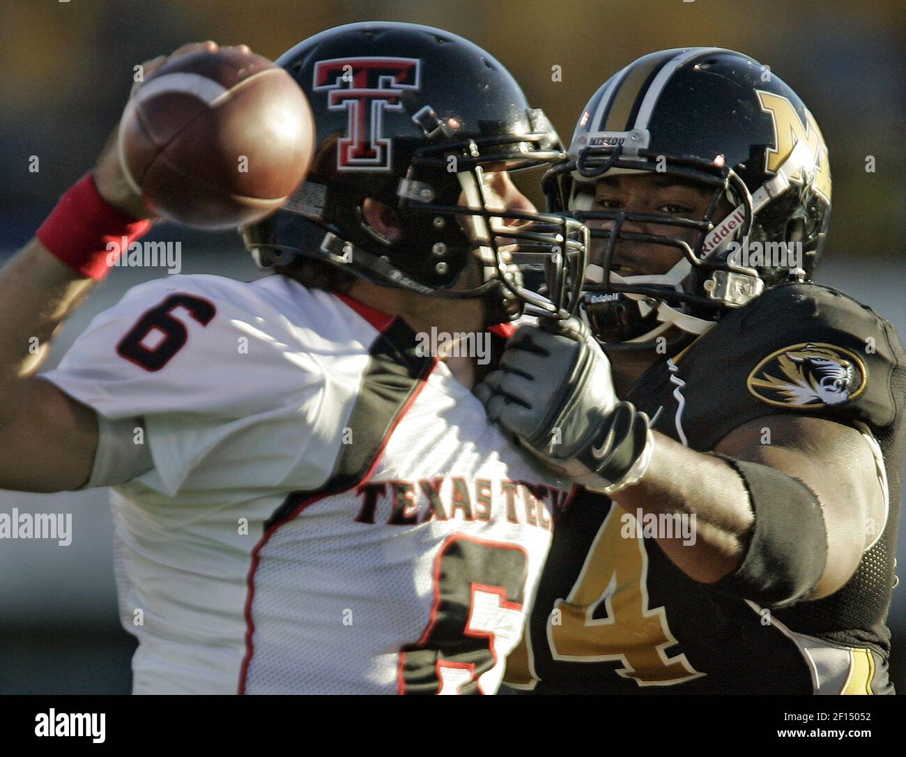 Missouri Evander Hood (right) pressures Texas Tech quarterback Graham ...