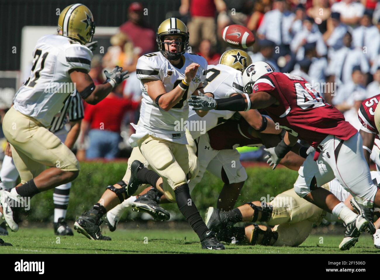 Vanderbilt quarterback Mackenzi Adams pitches the ball to running back ...