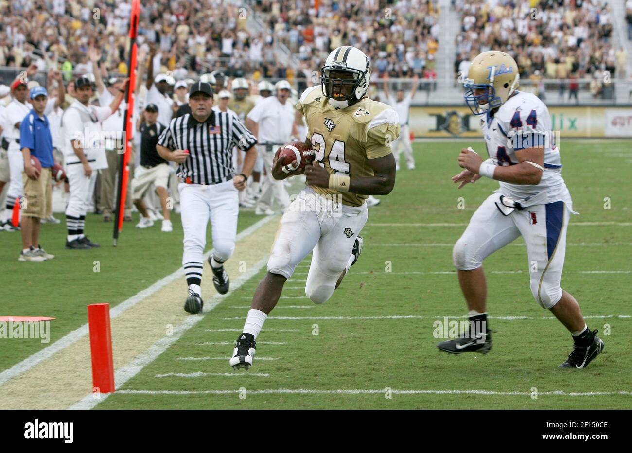 Central Florida's Kevin Smith (24) runs in a touchdown during the first ...