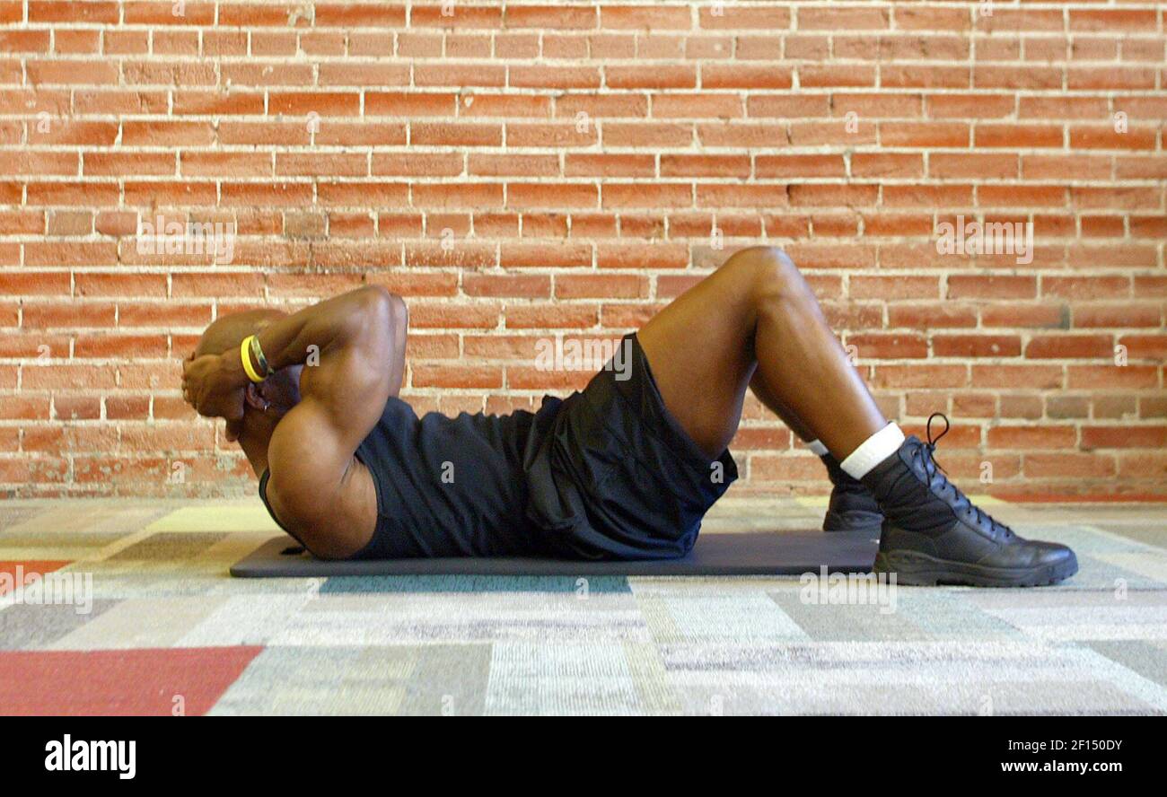Certified personal trainer Keith Hunter shows the unsafe method for sit ...