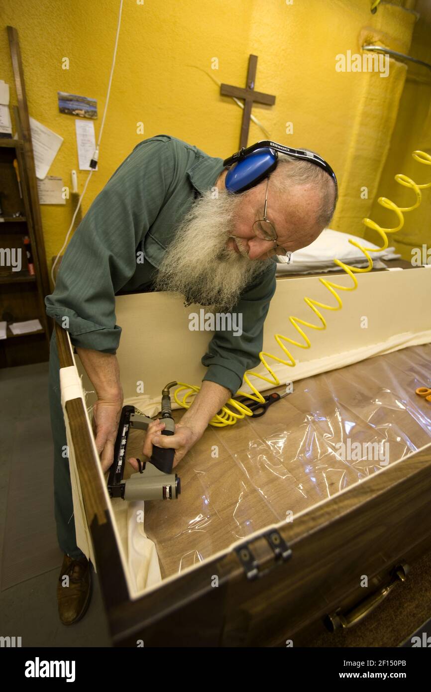Brother Paul Halaburt, a Cistercian (Trappist) monk, builds a casket at ...