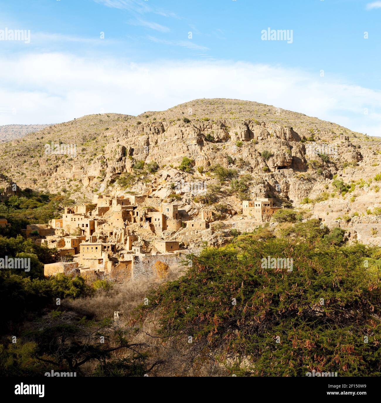 In oman mountain the old abandoned village arch house and cloudy sky ...