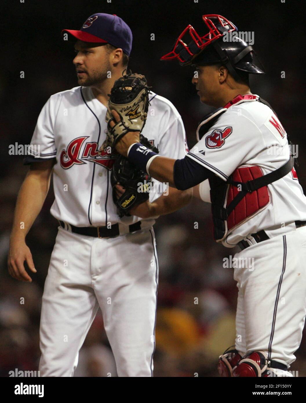 Cleveland Indians catcher Victor Martinez (right) visits pitcher Jake ...