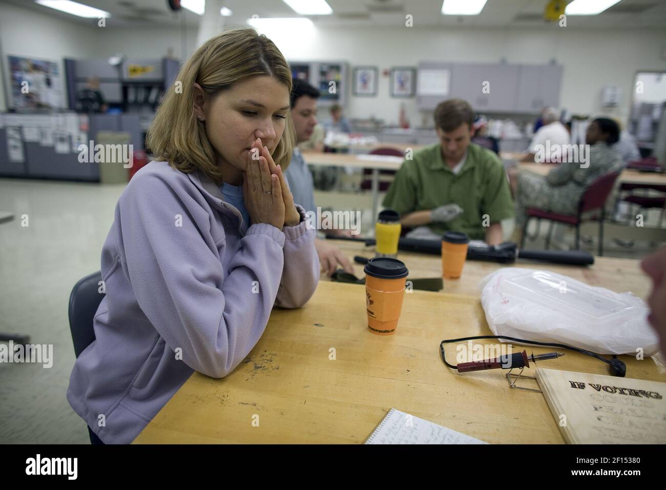 Occupational therapist Oren Ganz works with Sgt. Ted Wade of the 82nd ...