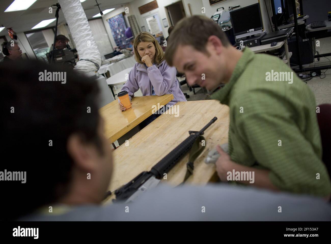 Occupational therapist Oren Ganz talks with Sgt. Ted Wade of the 82nd ...