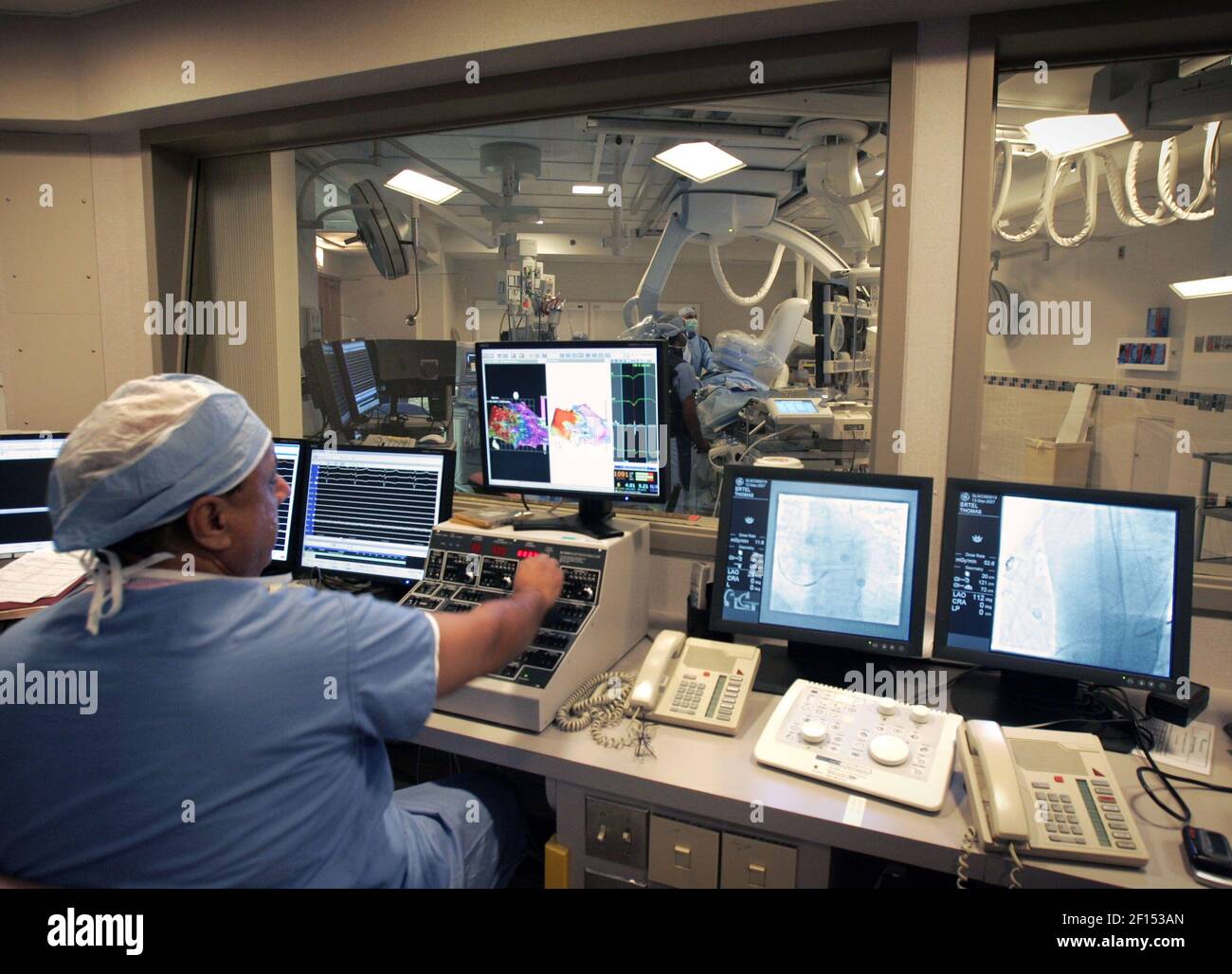 Electrophysiologist Jasbir Sra monitors a new computer imaging system ...