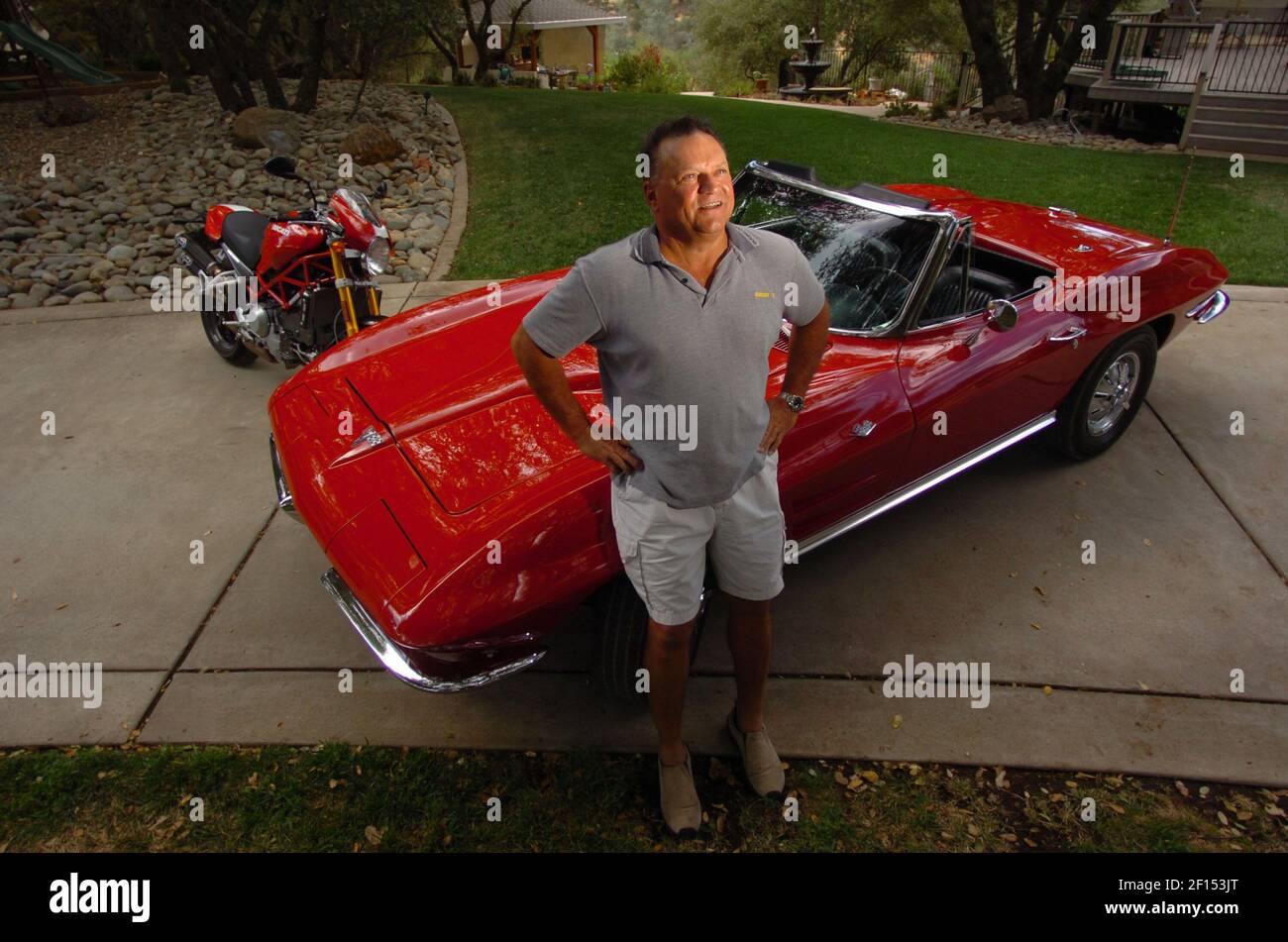 Tony Sica stands by his "toys," a Corvette and his motorcycle, August ...