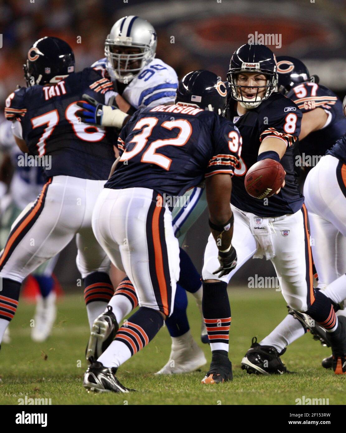 Chicago Bears quarterback Rex Grossman (8) hands the ball to running ...