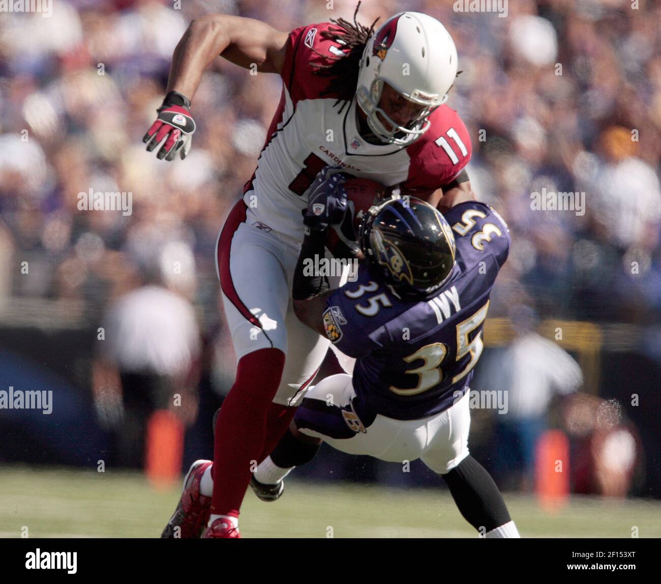 The Baltimore Ravens' Corey Ivy (35) strips the ball from the Arizona ...