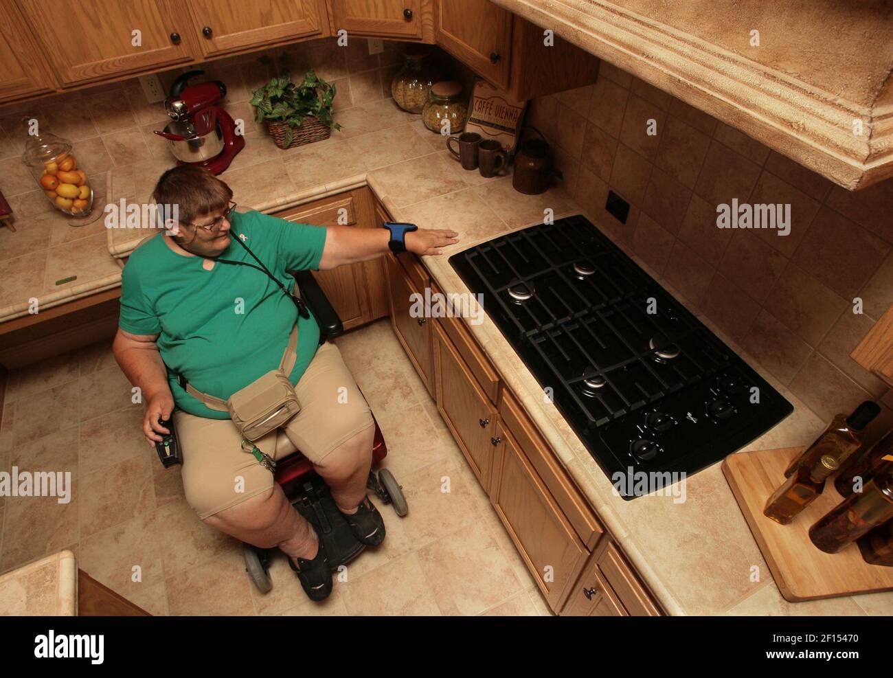 Carol Casey checks out the kitchen as she tours Granville Homes ...
