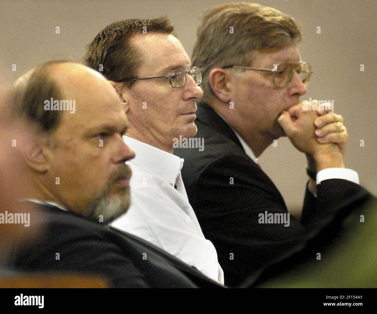 Vinson Filyaw (center) flanked by his two attorneys Jack Duncan (left ...