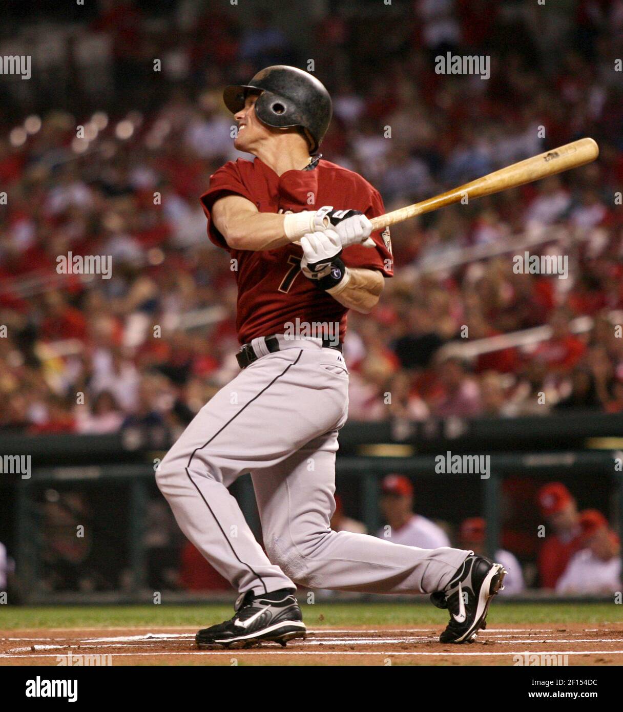 Houston Astros' Craig Biggio swings and flies out to center in his ...