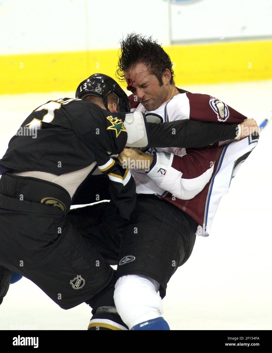 Dallas Stars' Krys Barch (left) battles Colorado Avalanche's Mark ...