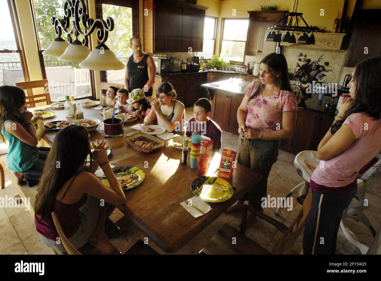 The Cimorelli family prays before dinner at their El Dorado Hills home ...