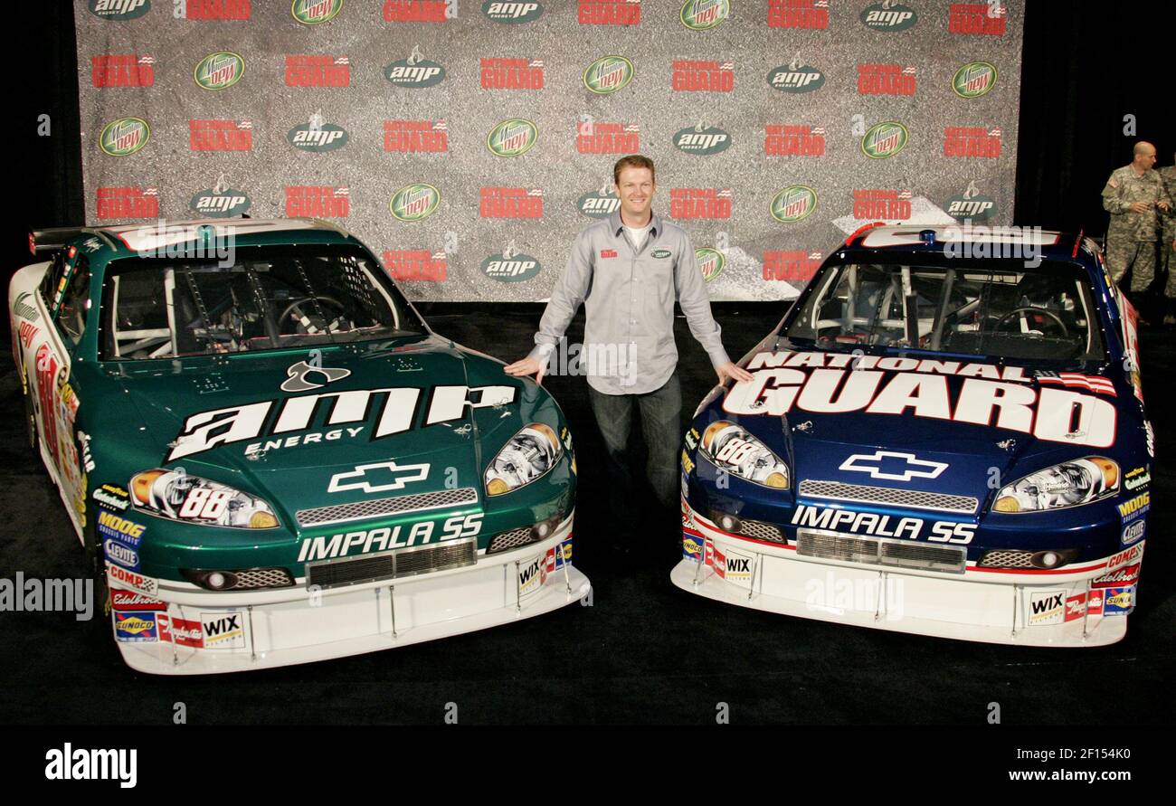 Dale Earnhardt Jr. stands with his 2008 cars after a press conference ...