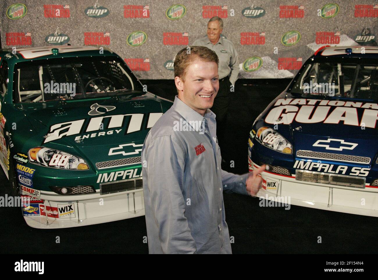 Dale Earnhardt Jr. stands with his 2008 cars after a press conference ...