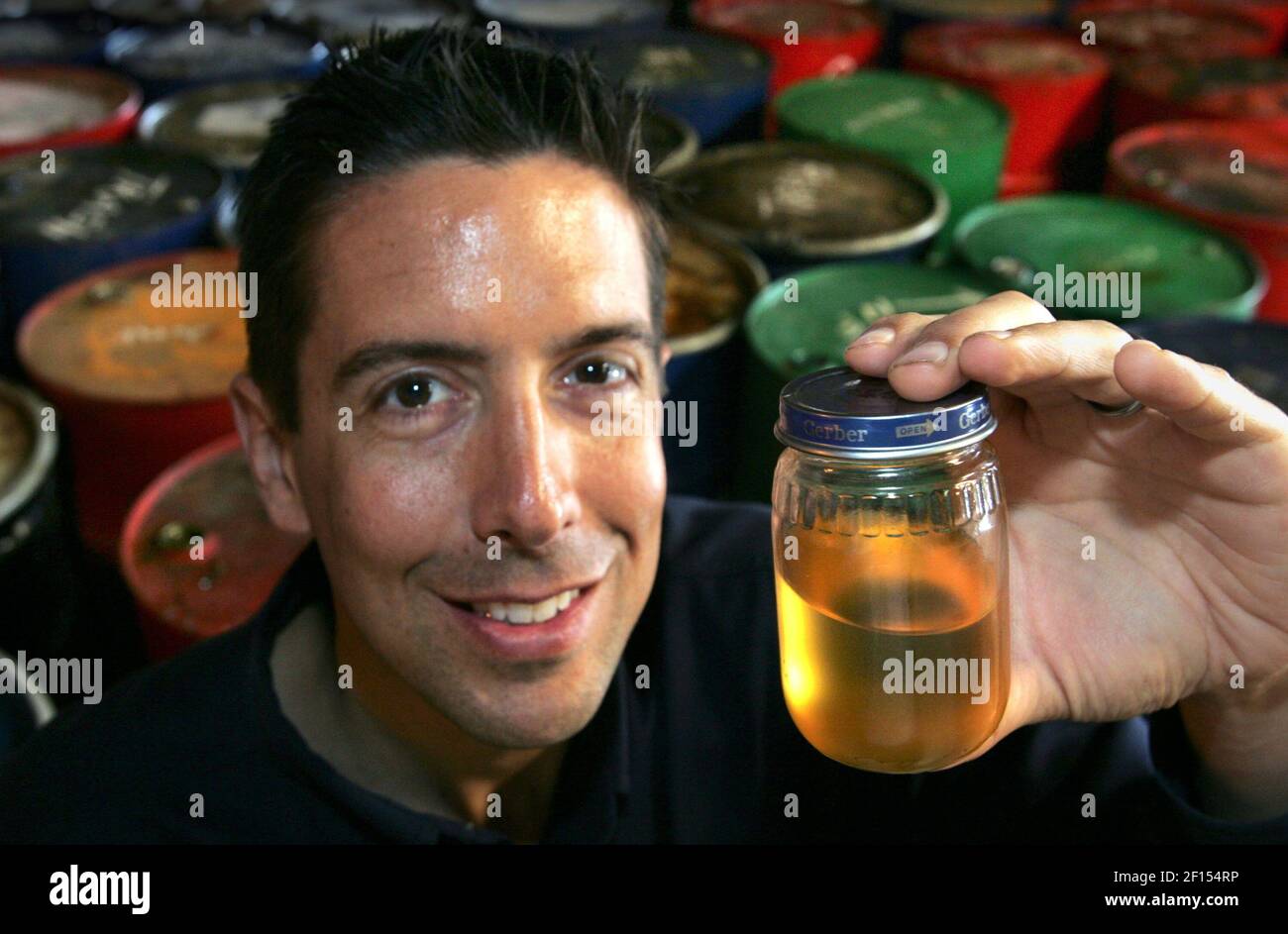 Troy Helming, president and CEO of Krystal Energy Corp., shows a sample ...