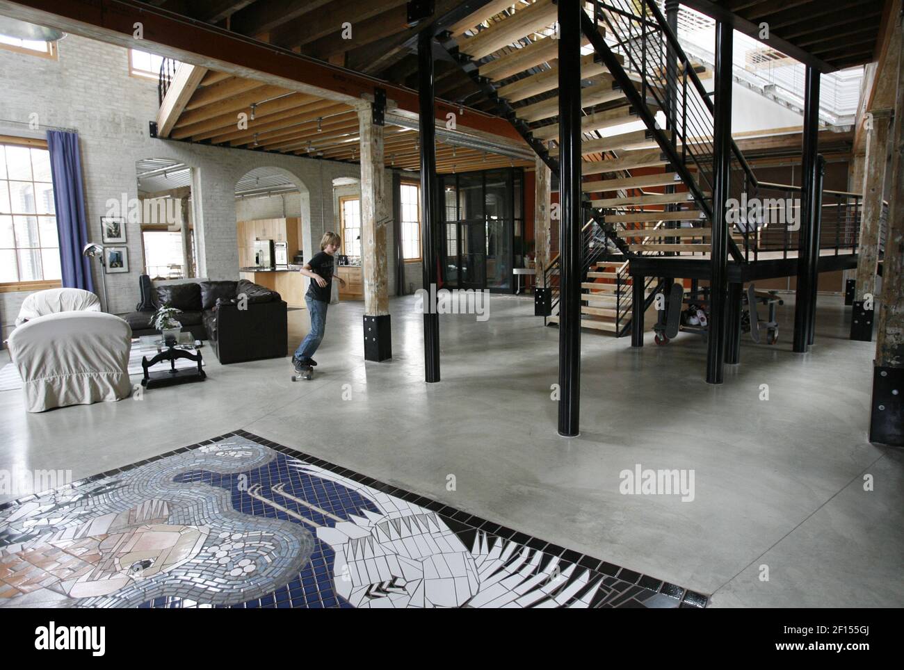 Max Vickers, 12, skates through the renovated Featherbone factory in ...