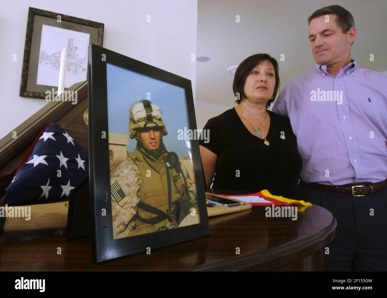 Tom, right, and wife Jannette Manion pose for portrait at their home in ...
