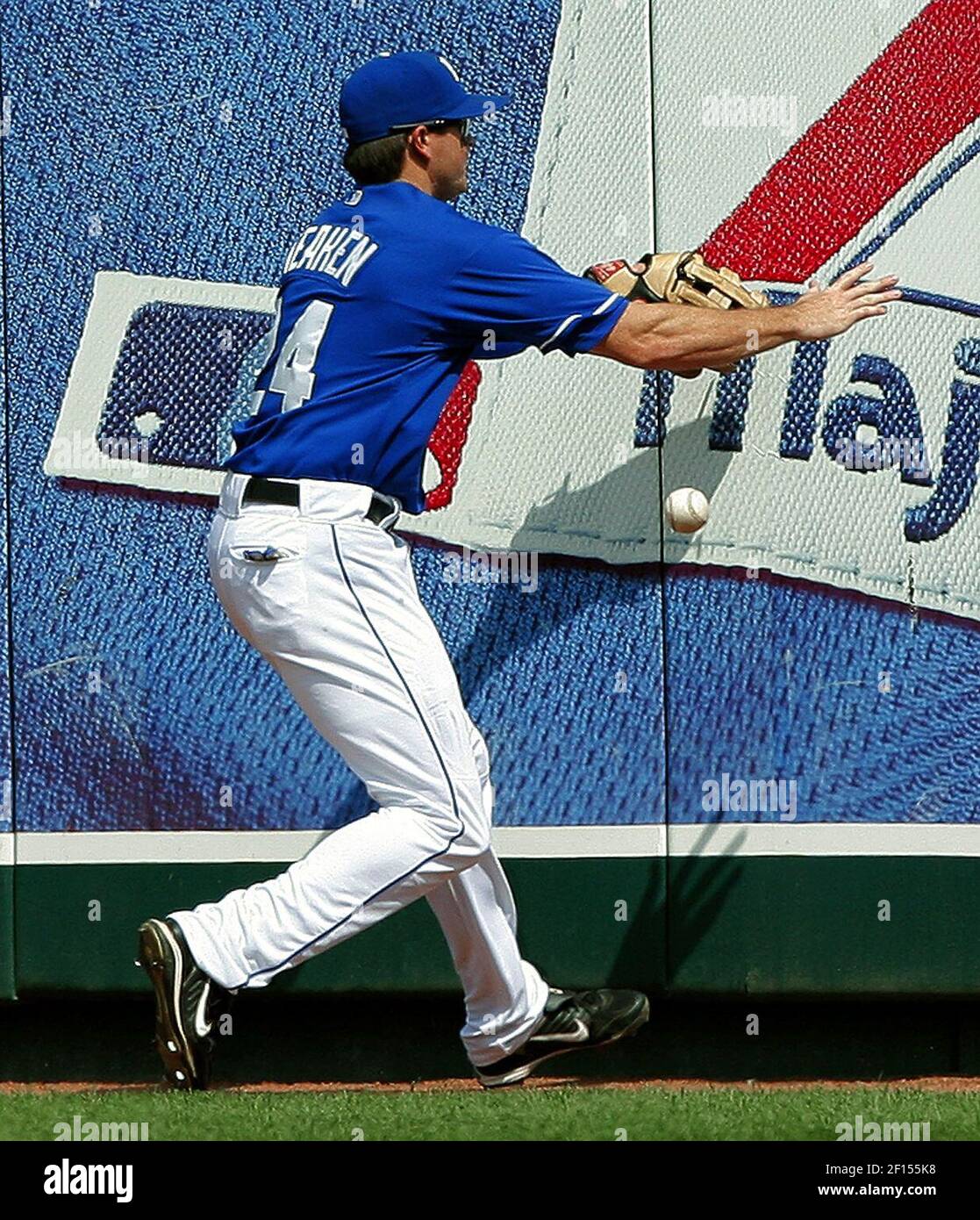 Kansas City Royals right fielder Mark Teahen gets turned around and ...
