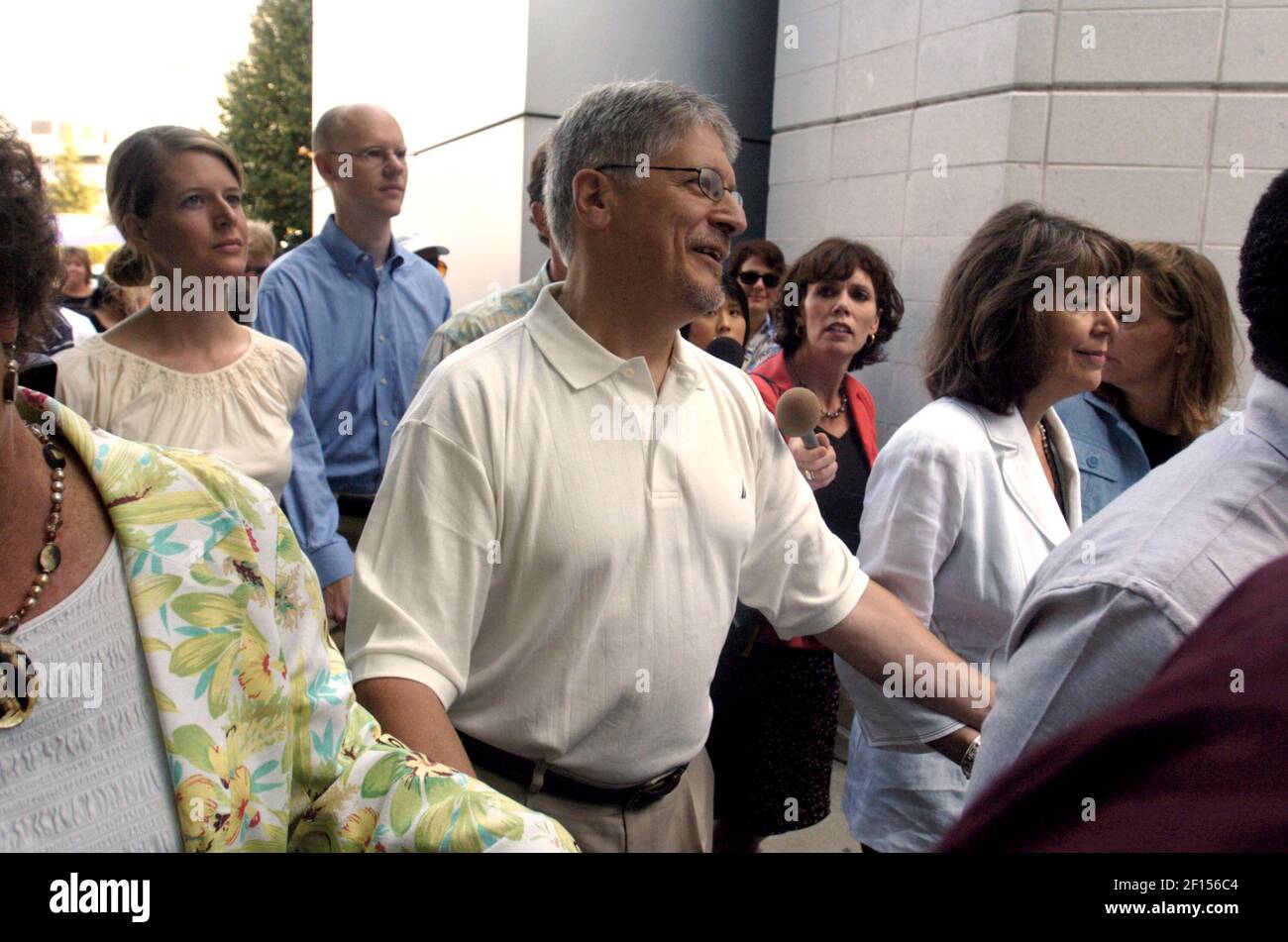 Mike Nifong, former Durham district attorney, center, flanked by his ...